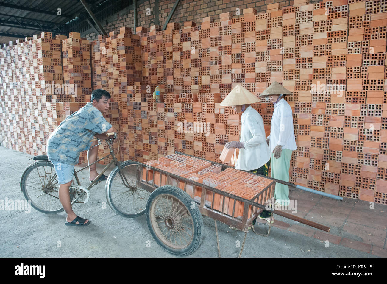 Vietnamese women work in an old brickworks in the Mekong delta. The ...