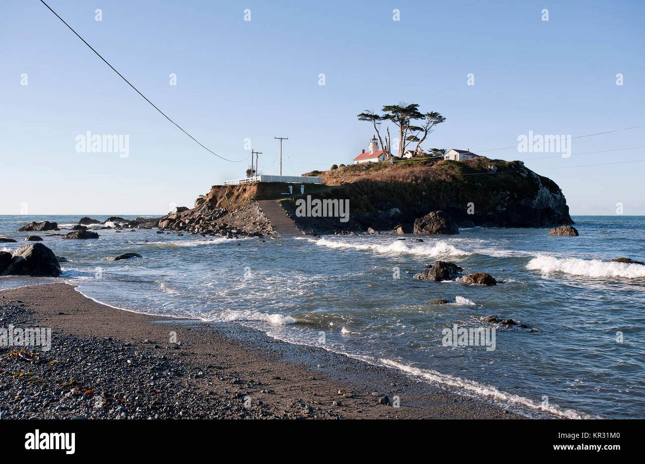 Battery Point Lighthouse during high tide. Ocean waves covering the ...