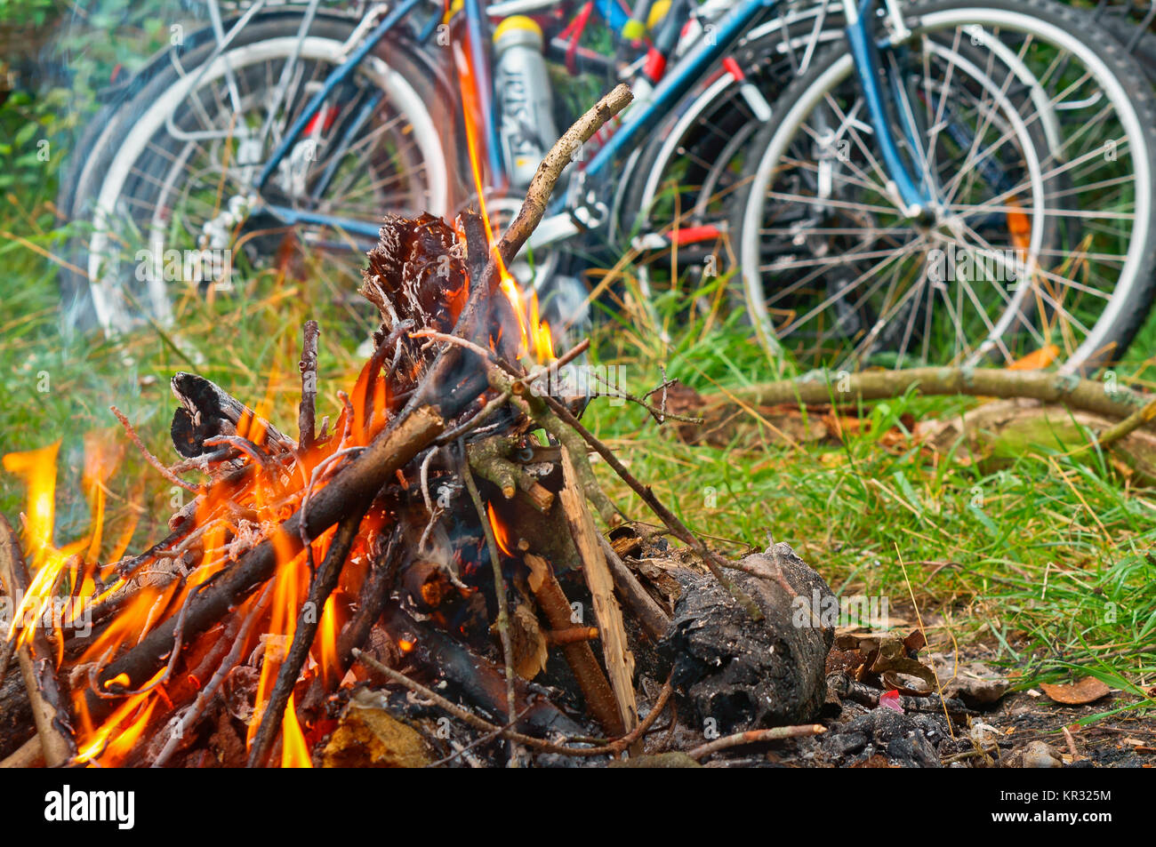 bike trip, cyclists tourists made a fire Stock Photo - Alamy
