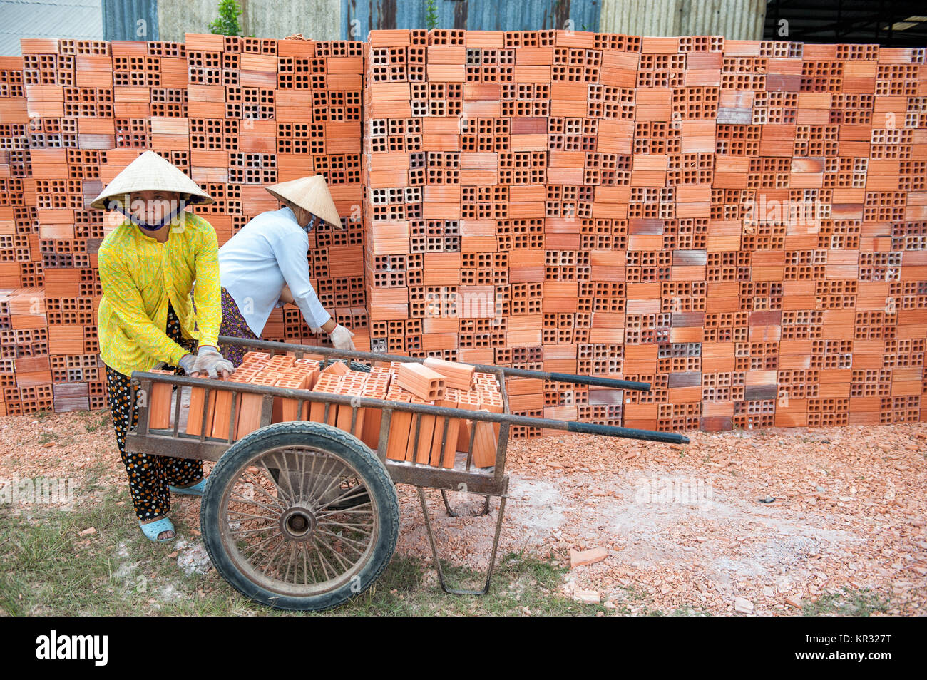 Vietnamese women work in an old brickworks in the Mekong delta. The ...