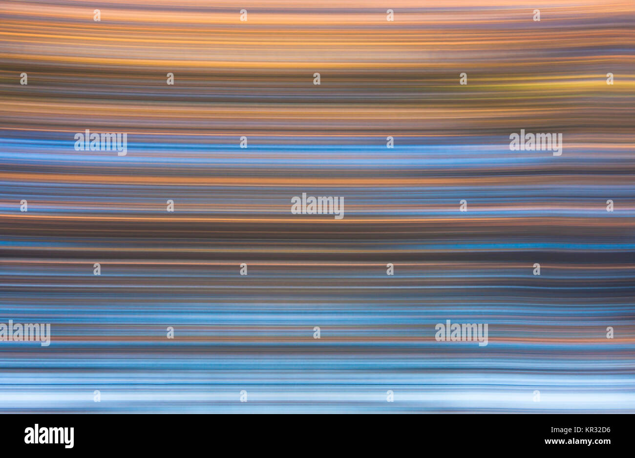 Abstract blurry soft and smooth blue and orange lines in fast motion ...