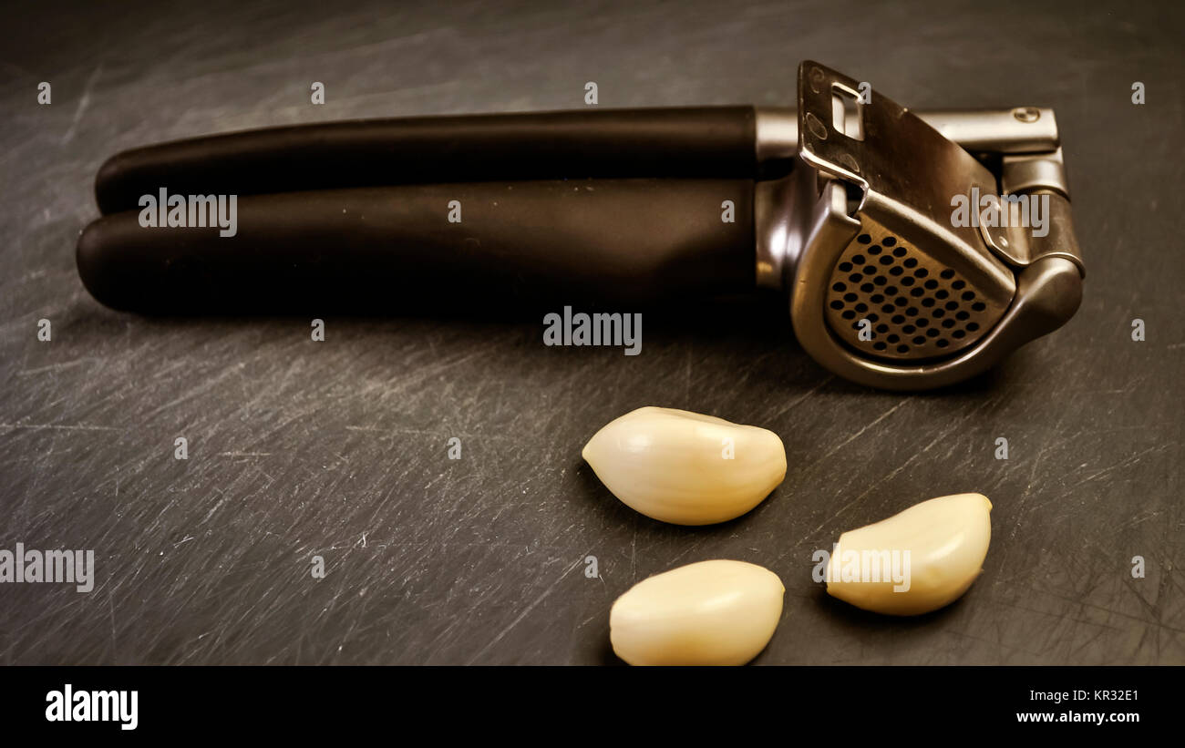 A composition of cloves of garlic on the table Stock Photo - Alamy