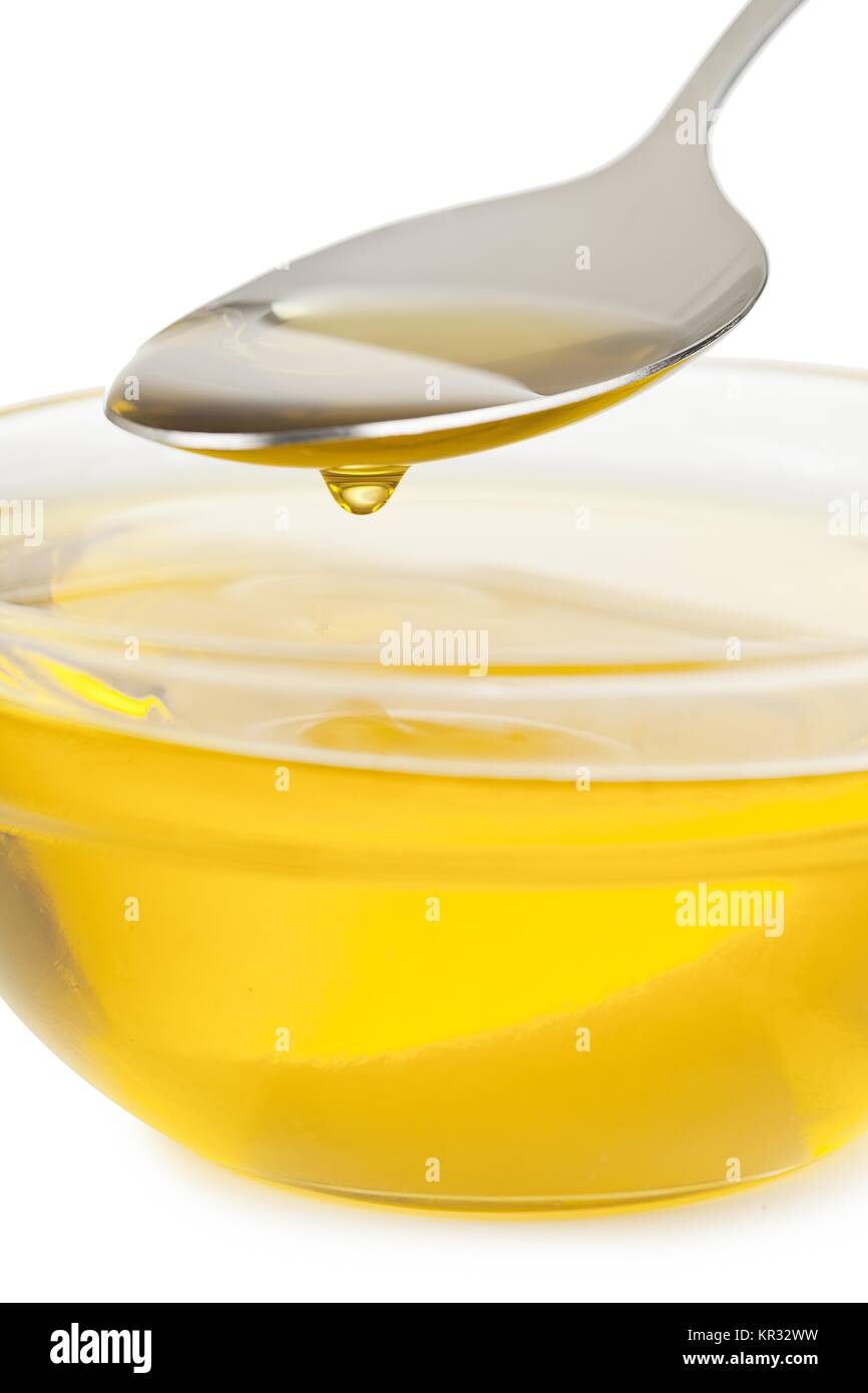 spoon and bowl of oil Stock Photo - Alamy