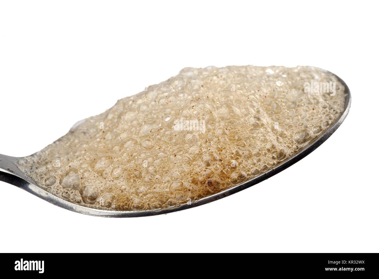 spoon full of brown bubbles Stock Photo - Alamy