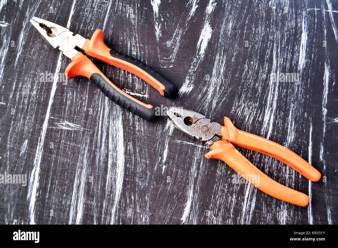 Pliers for repair work lying on the table. Repair tools in the h Stock ...