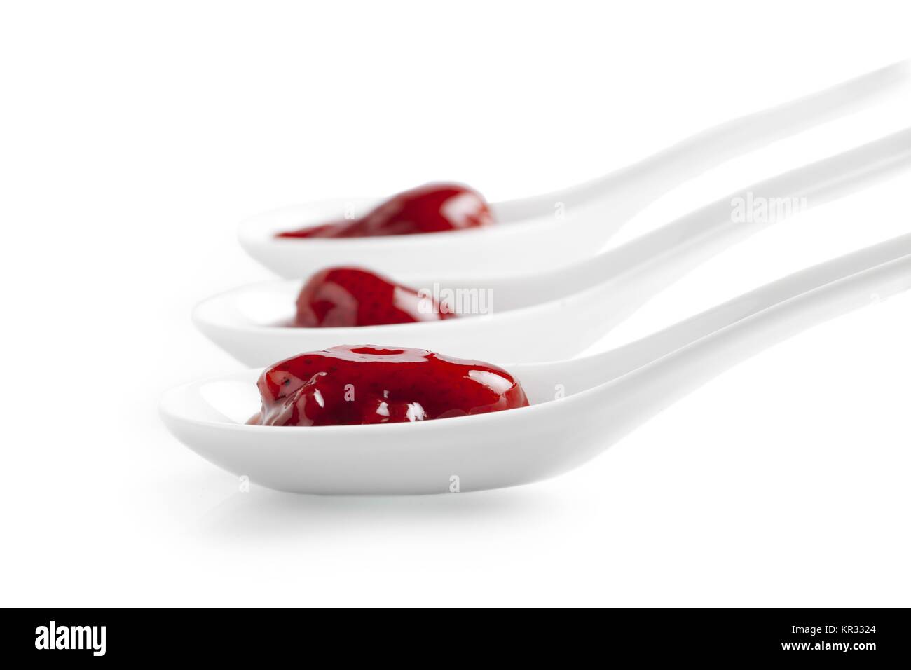 strawberry jam in spoons Stock Photo - Alamy