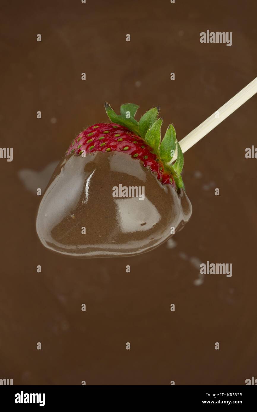 strawberry on melted chocolate Stock Photo - Alamy