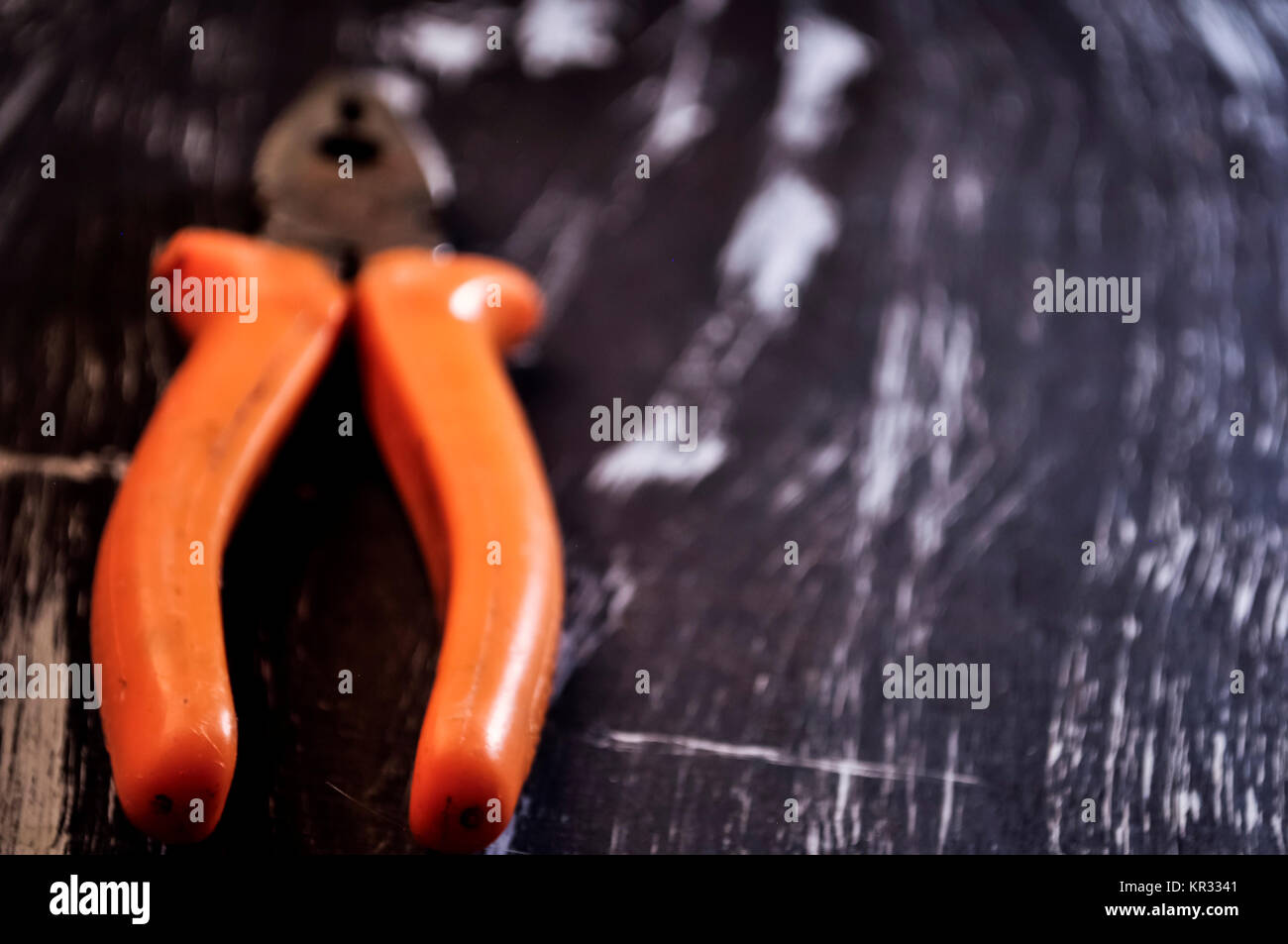 Pliers for repair work lying on the table. Repair tools in the h Stock ...