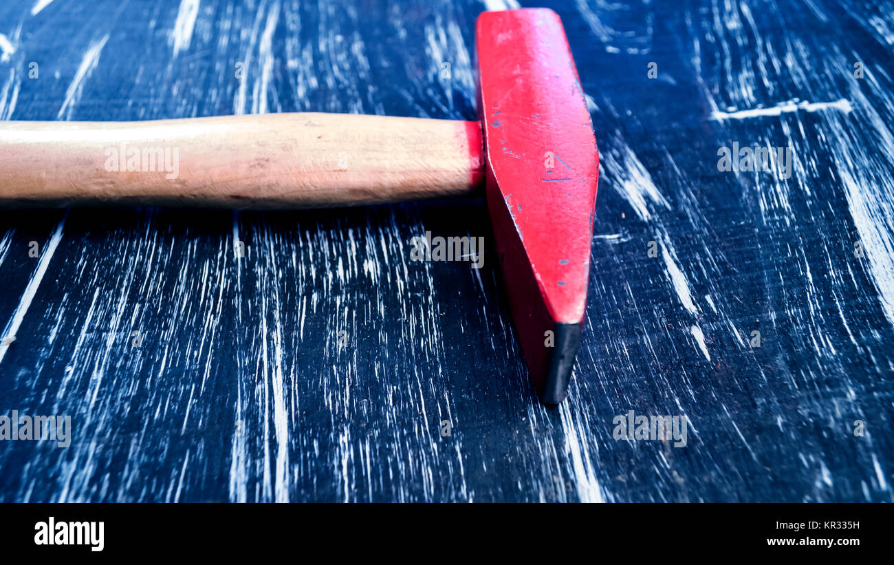 Hammer to repair lying on a wooden table. Men's housework. Worki Stock ...