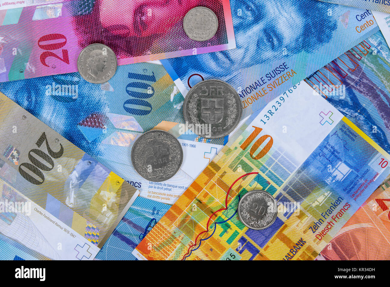 swiss franc banknotes and coins as background Stock Photo - Alamy