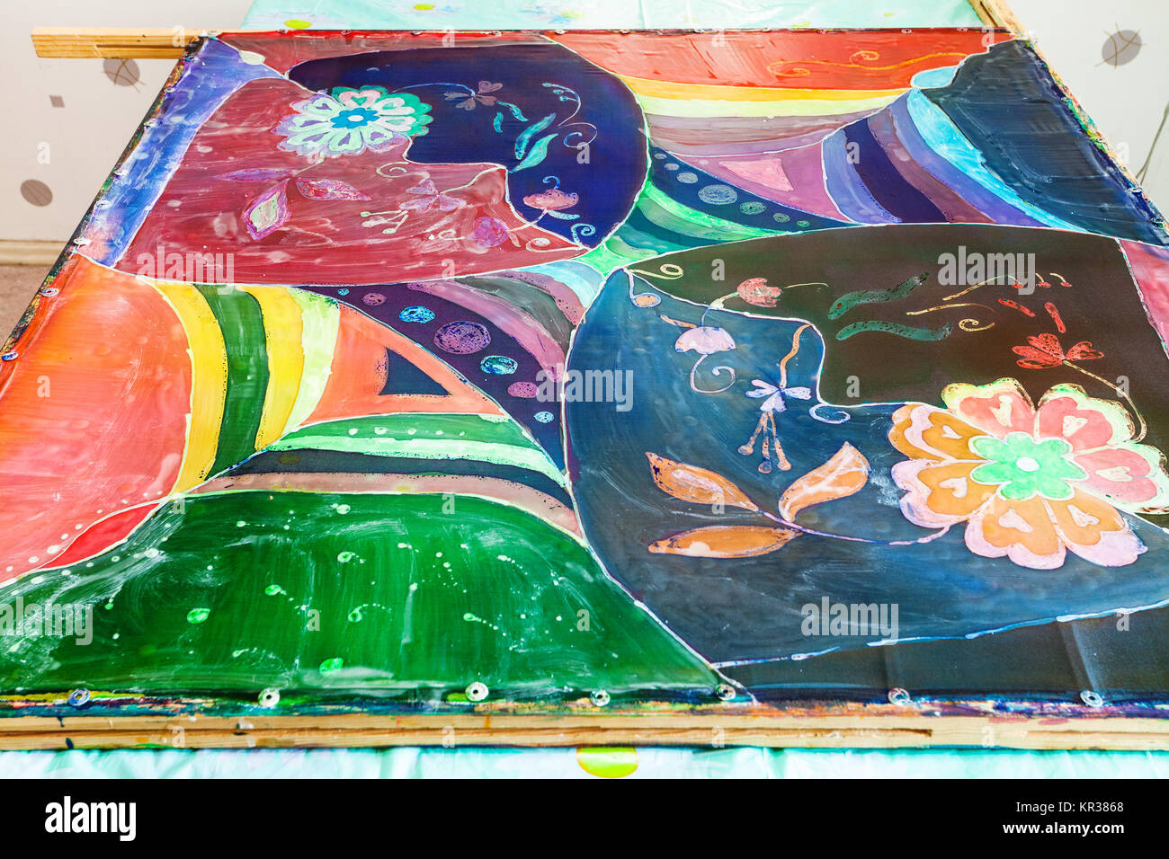finally painted batik in frame before the fixing Stock Photo - Alamy
