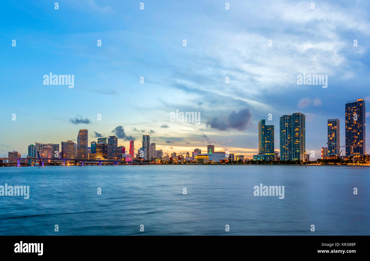 Miami city skyline panorama at night with urban skyscrapers and bridge ...