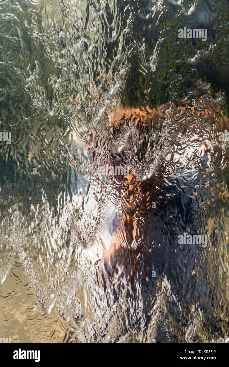 beautiful pattern of flowing water at a metal wall Stock Photo - Alamy