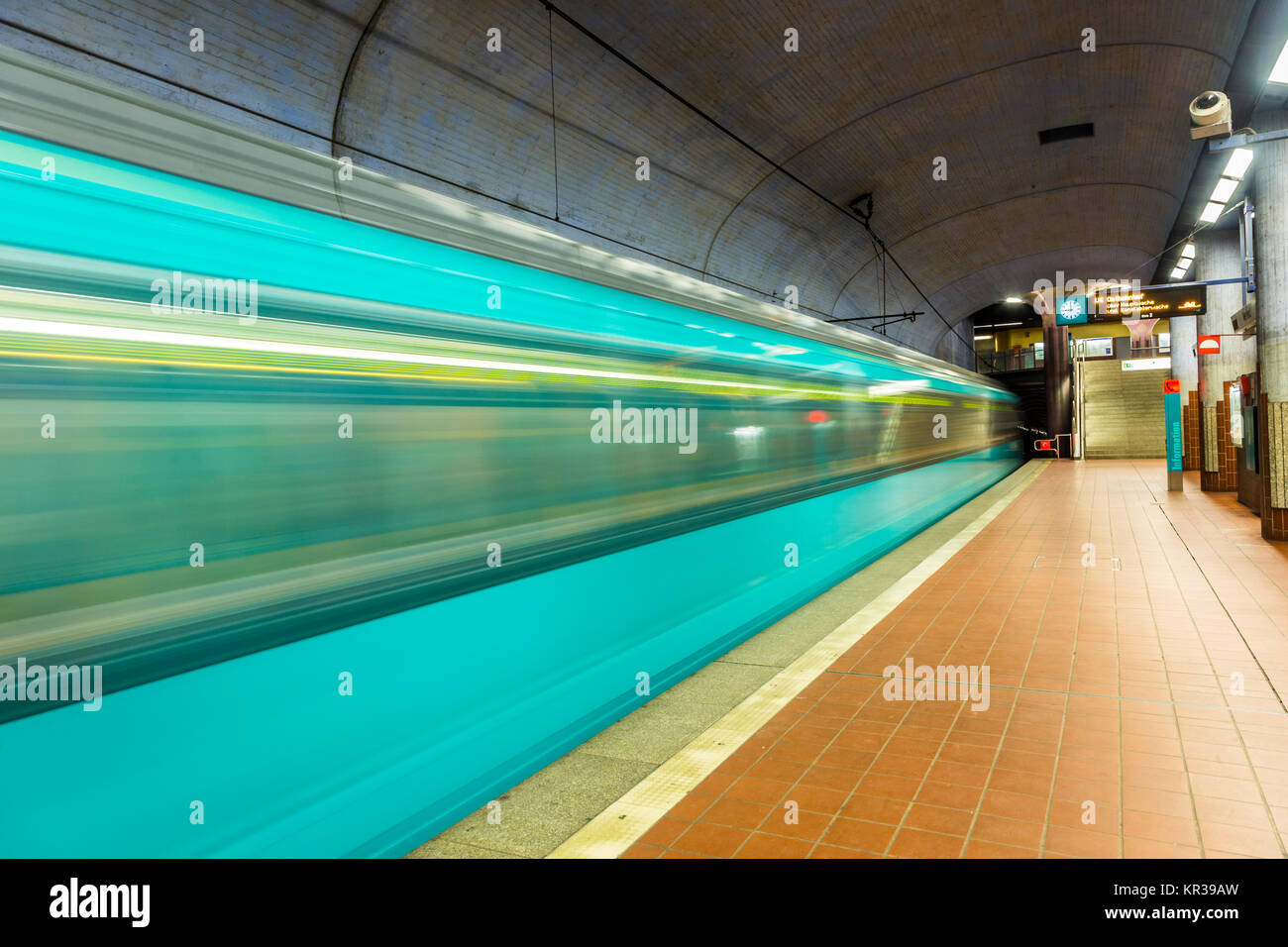 metro station with train arriving Stock Photo - Alamy