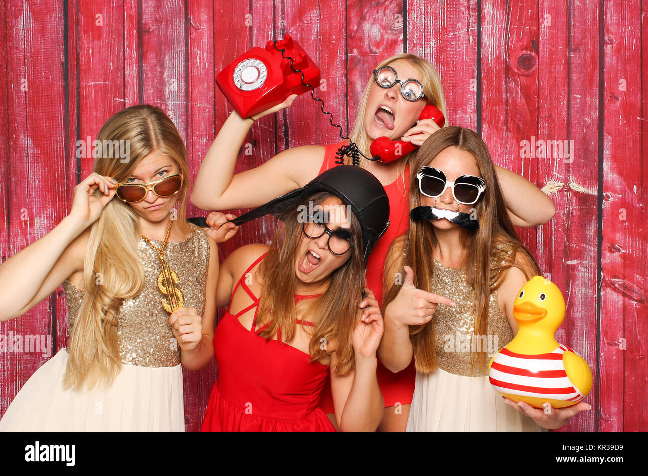young girls fool around before fotobox Stock Photo - Alamy