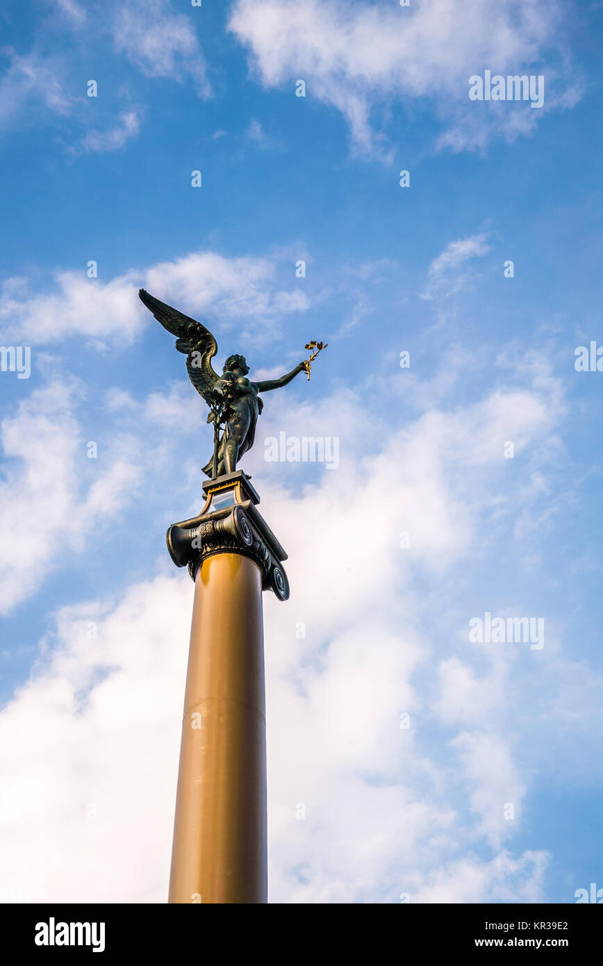 statue of an angel under the sky and clouds Stock Photo - Alamy