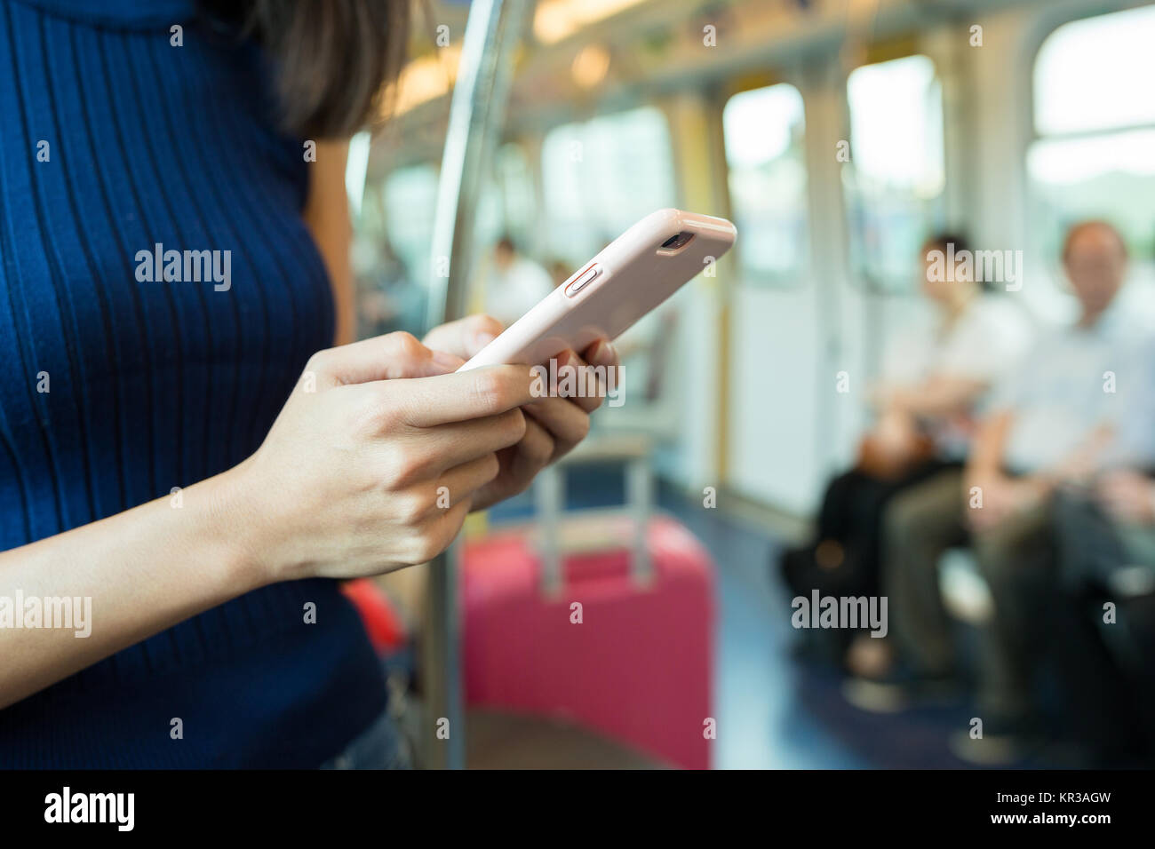 Woman using cellphone inside train compartment Stock Photo - Alamy