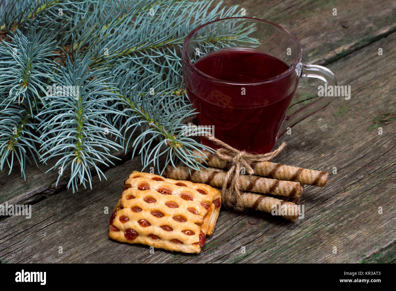cup of tea a fir-tree branch and cookies Stock Photo - Alamy