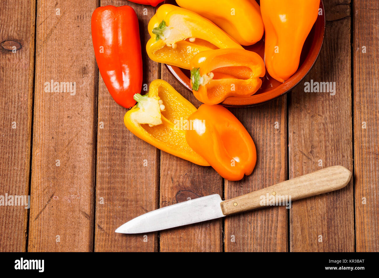 Small bell peppers in red and orange Stock Photo - Alamy