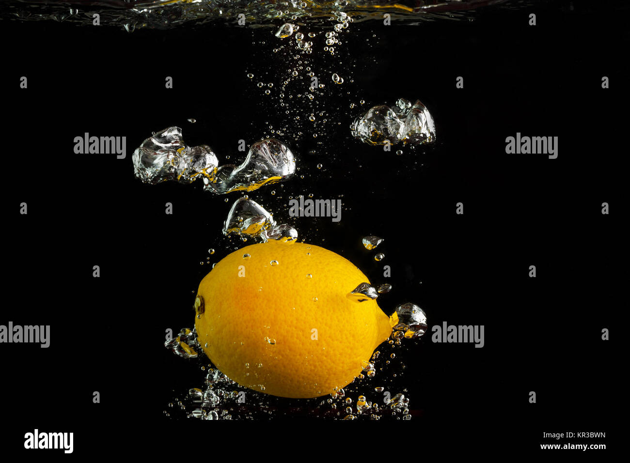 Shiny water drops falling black background hi-res stock photography and ...