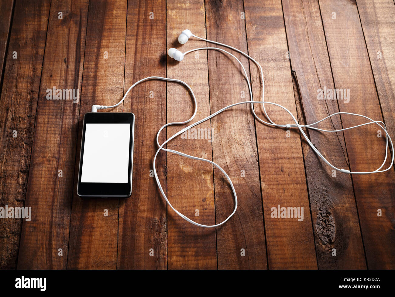 Smartphone with headphones Stock Photo - Alamy