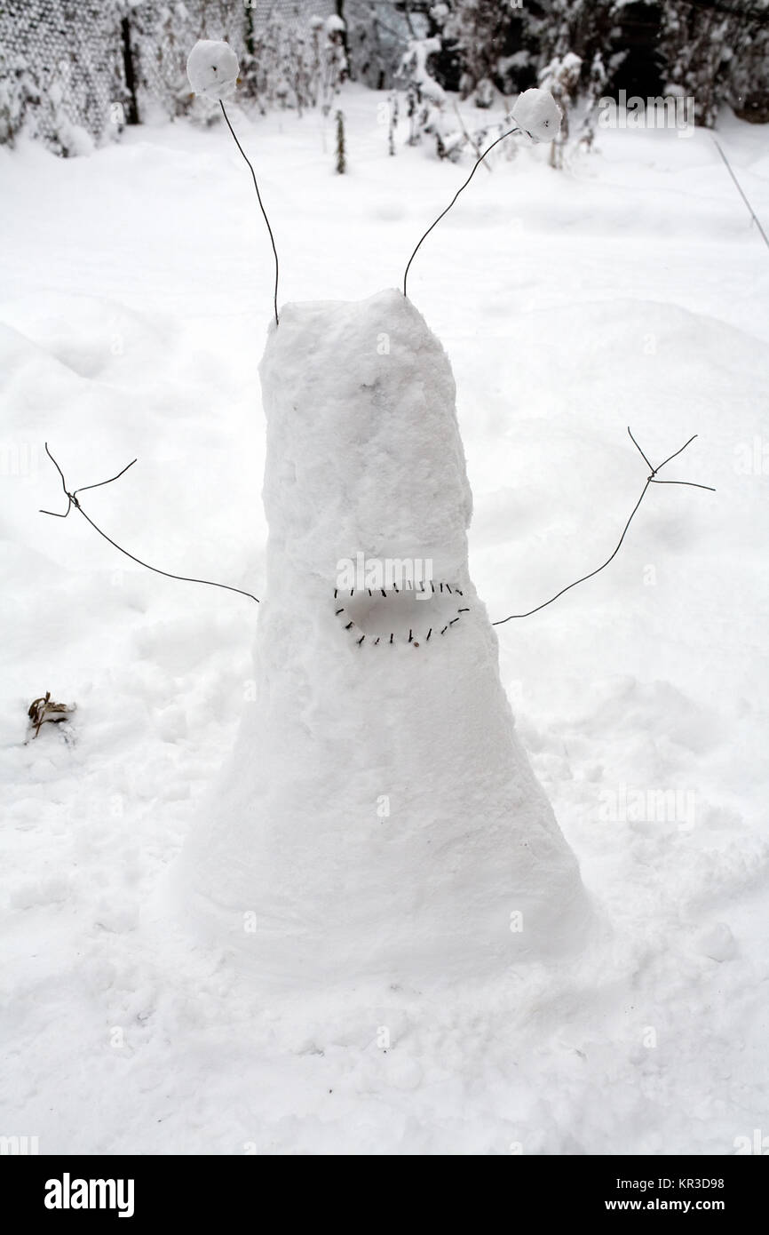 funny alien snowman figure closeup on outdoor background Stock Photo ...