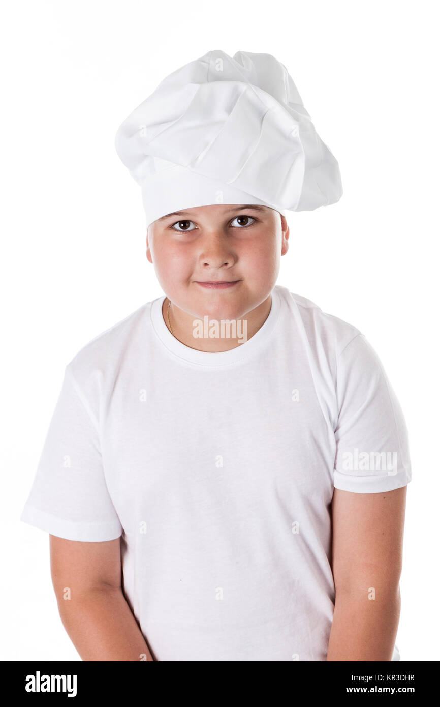One little boy as chef cook making salad, cooking with vegetable Stock ...