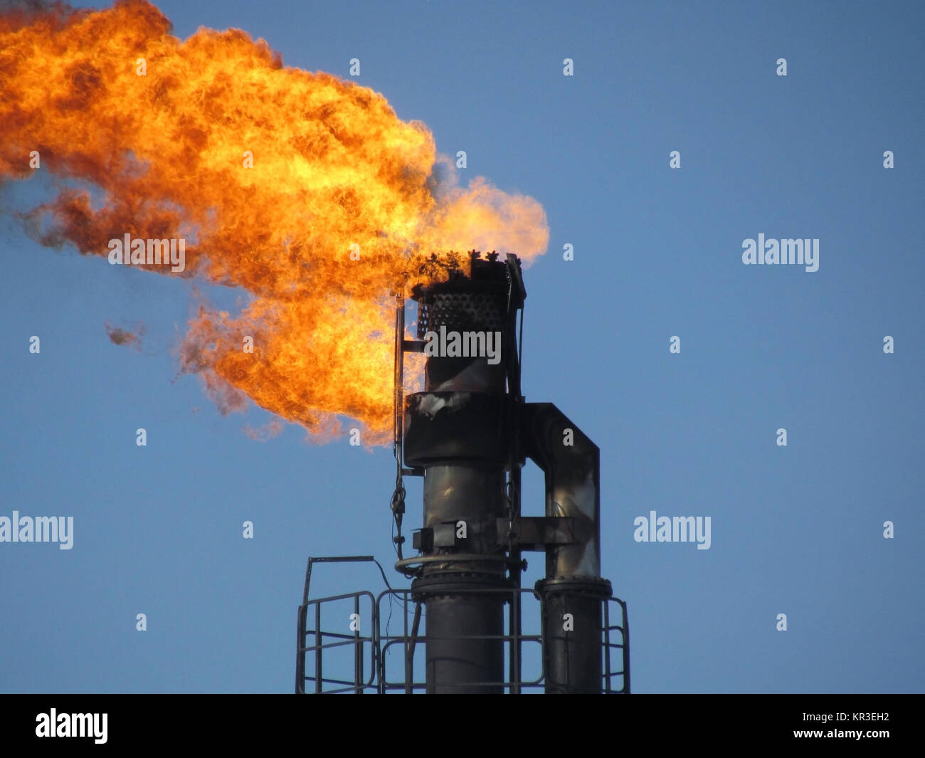 Torch system on an oil field Stock Photo - Alamy