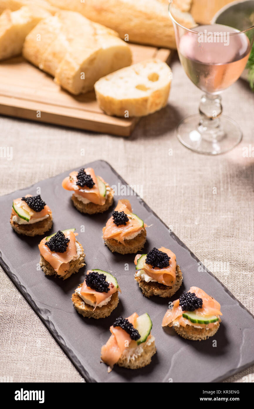 Smoked Salmon Canapes with Sour Cream and Caviar Stock Photo - Alamy