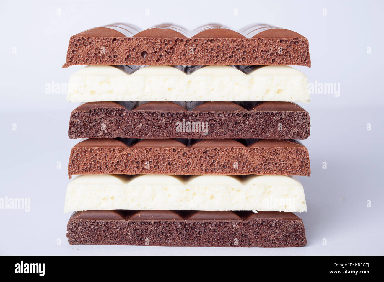 Chocolate stack on white background Stock Photo - Alamy