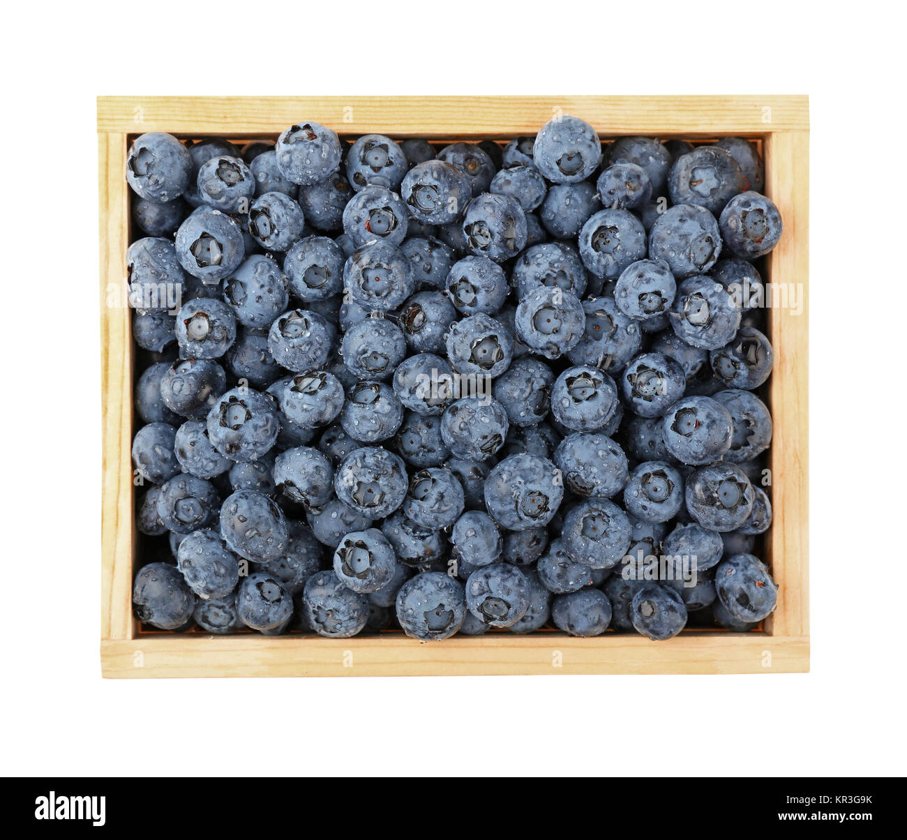 Close up wooden crate box of fresh washed blueberry berries with water ...