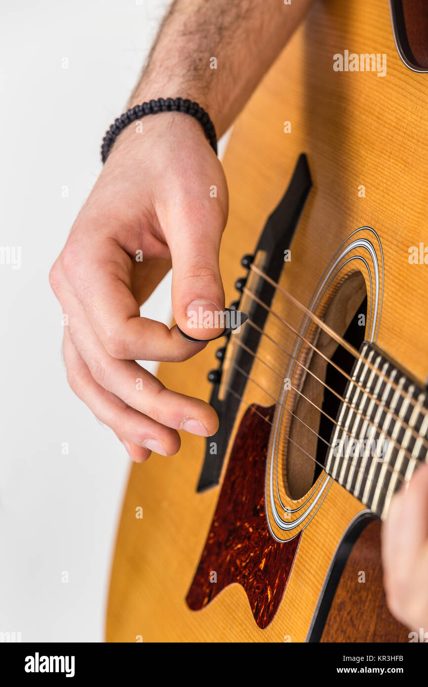 detail of fingers, string and hand of guitar player Stock Photo - Alamy