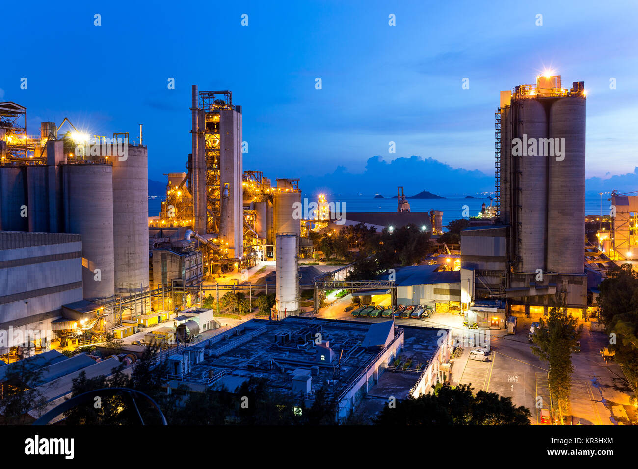 Cement industrial building at sunset Stock Photo - Alamy