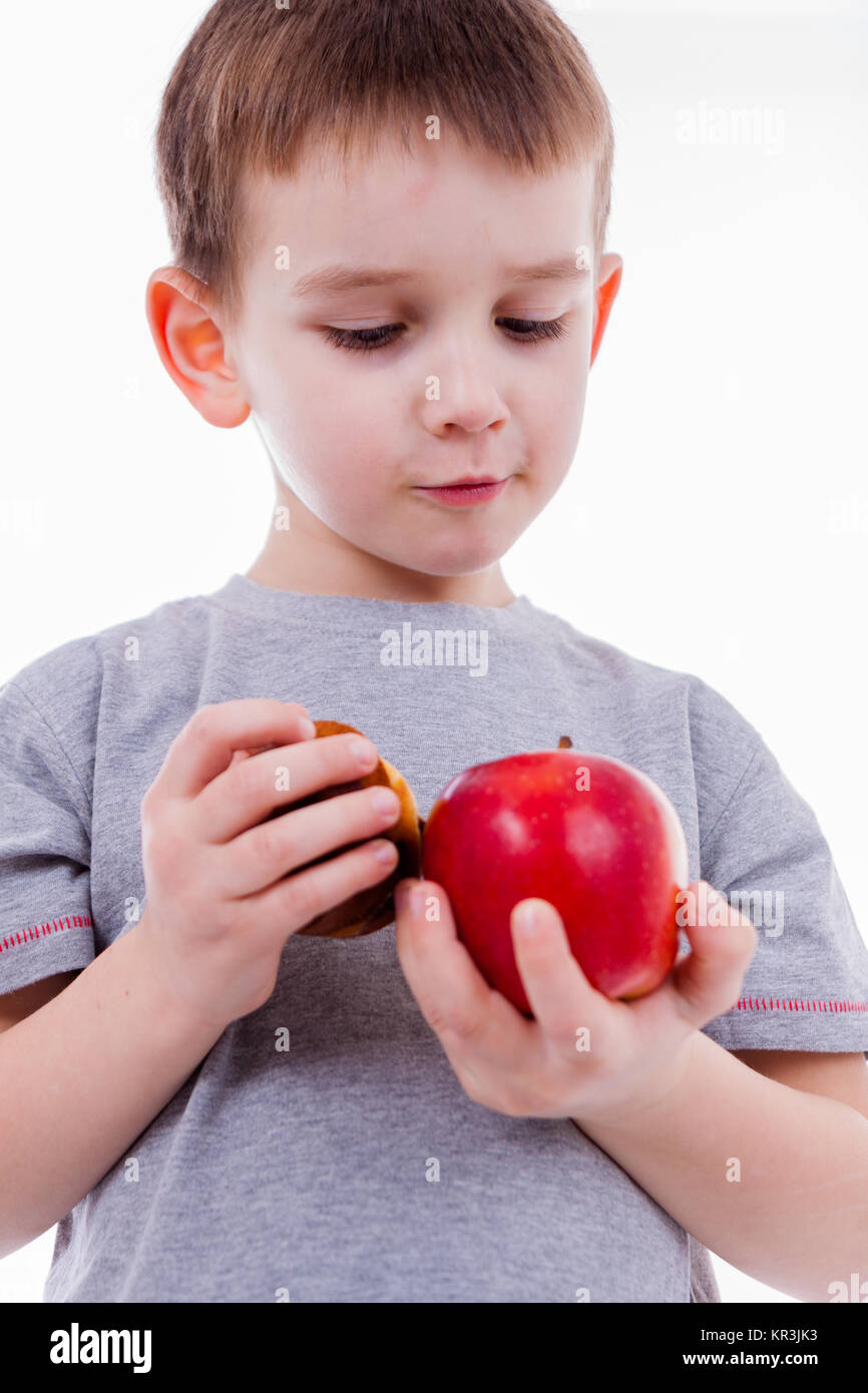 little boy with food isolated on white background - apple or a muffin ...