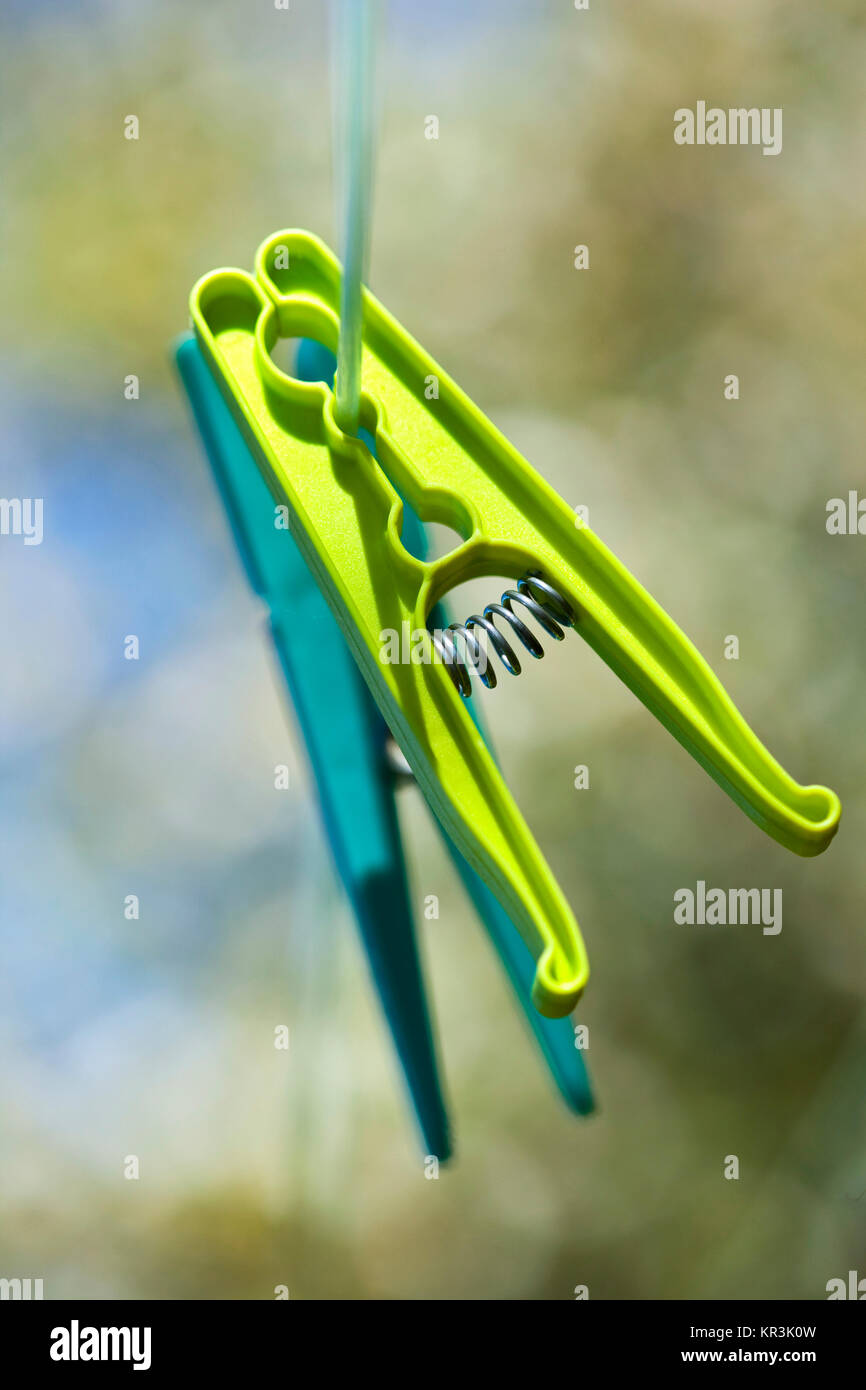 Laundry pins on a wire Stock Photo - Alamy
