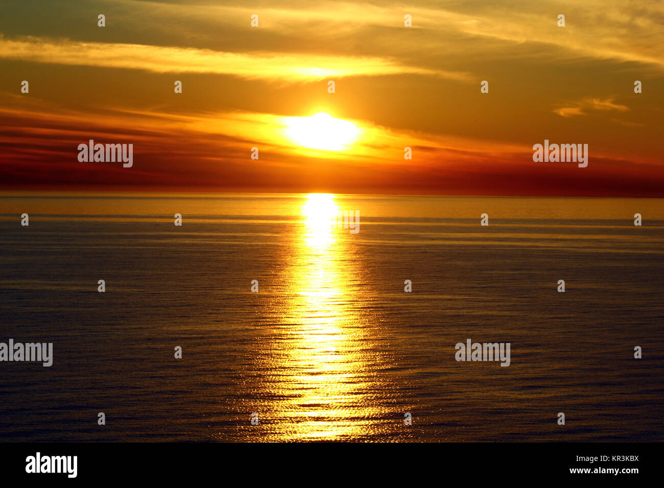 The sunset at the sea Stock Photo - Alamy