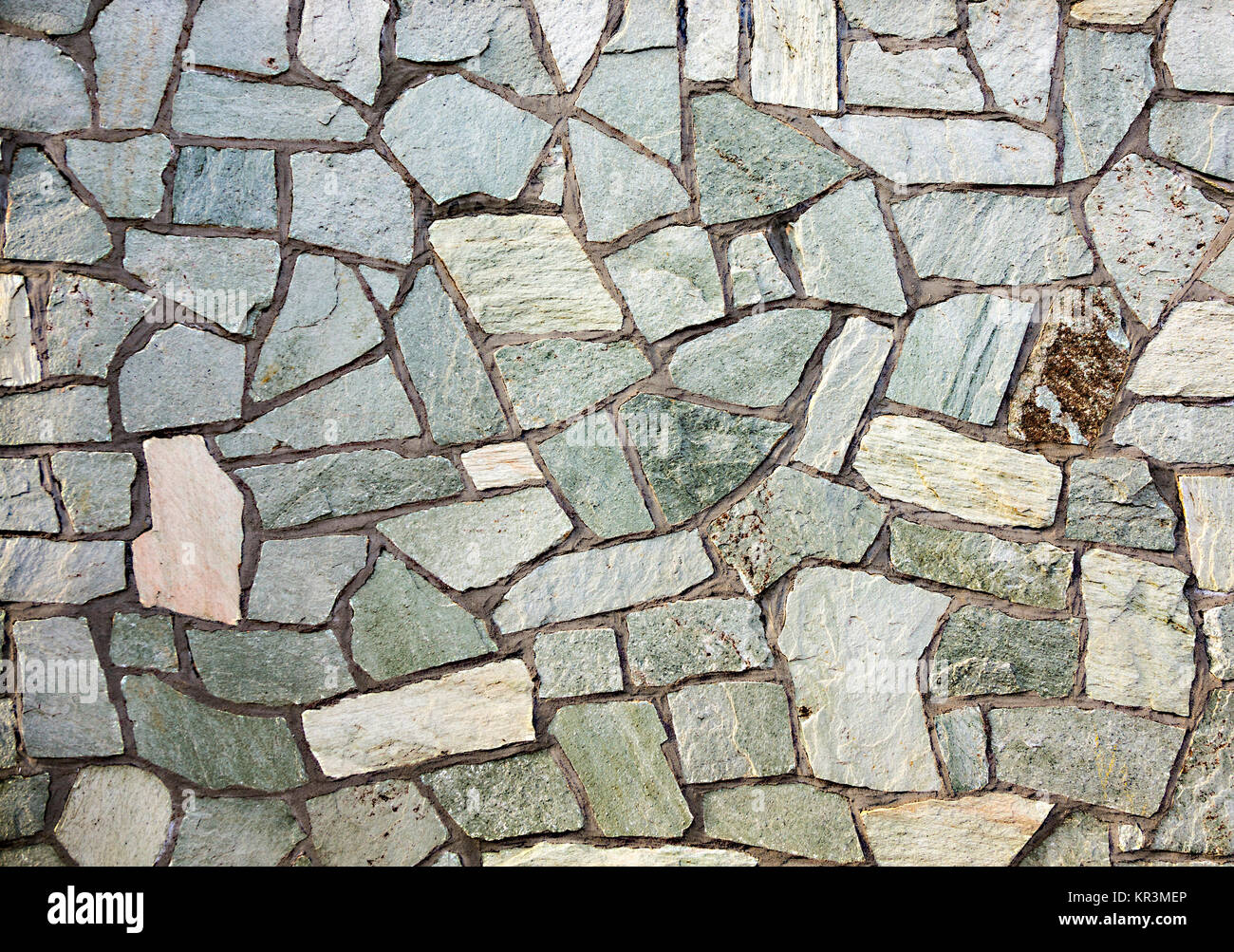 section of flagstone wall with varying shapes and lines Stock Photo - Alamy