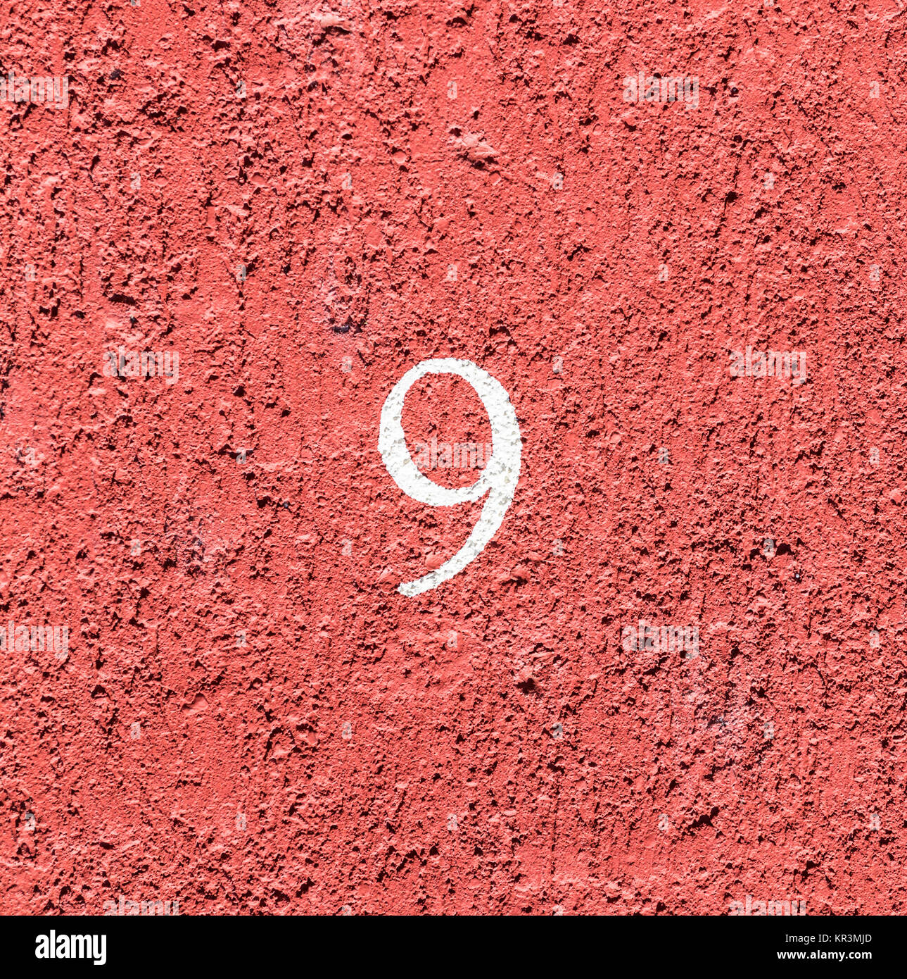 white House number 9 at red wall Stock Photo - Alamy