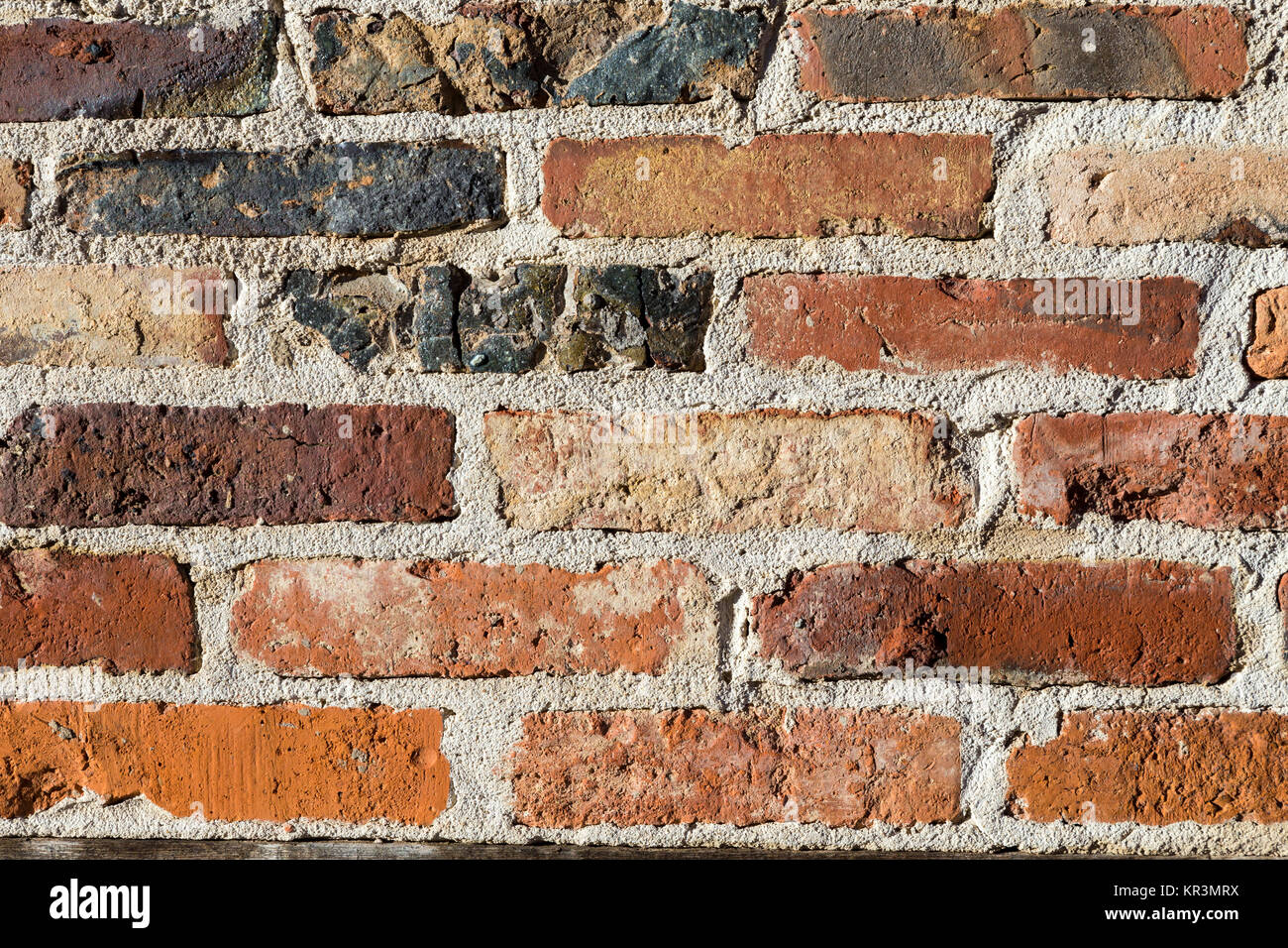 Weathered old red ancient brick stone wall Stock Photo - Alamy