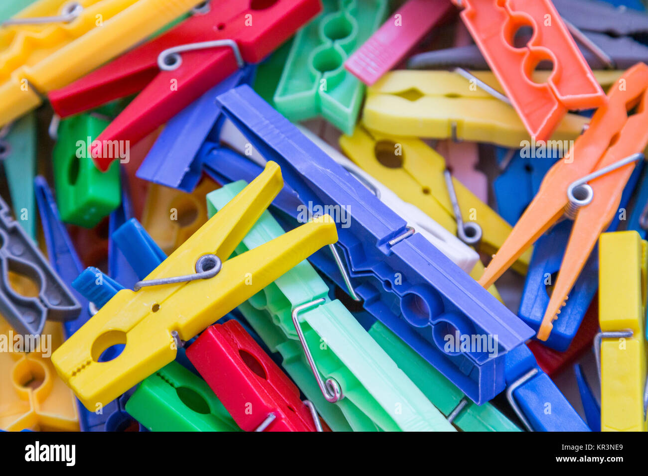 heap of plastic laundry clothespin in vivid colors Stock Photo - Alamy