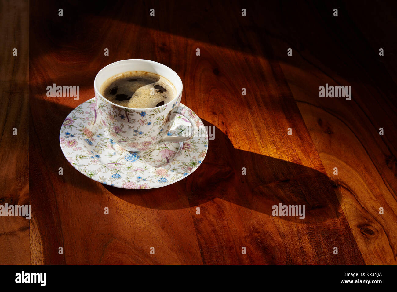 Cup of coffee in the afternoon sun Stock Photo - Alamy