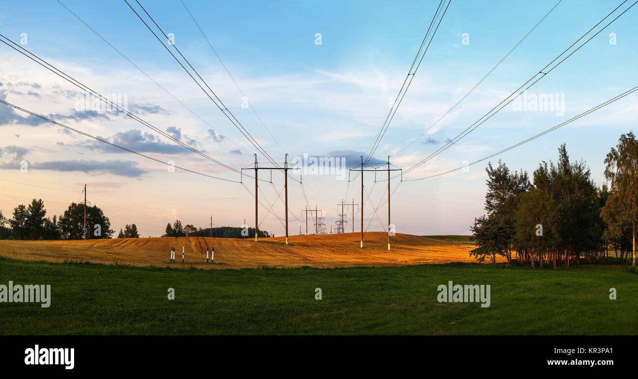 Electric pillars in a field Stock Photo - Alamy