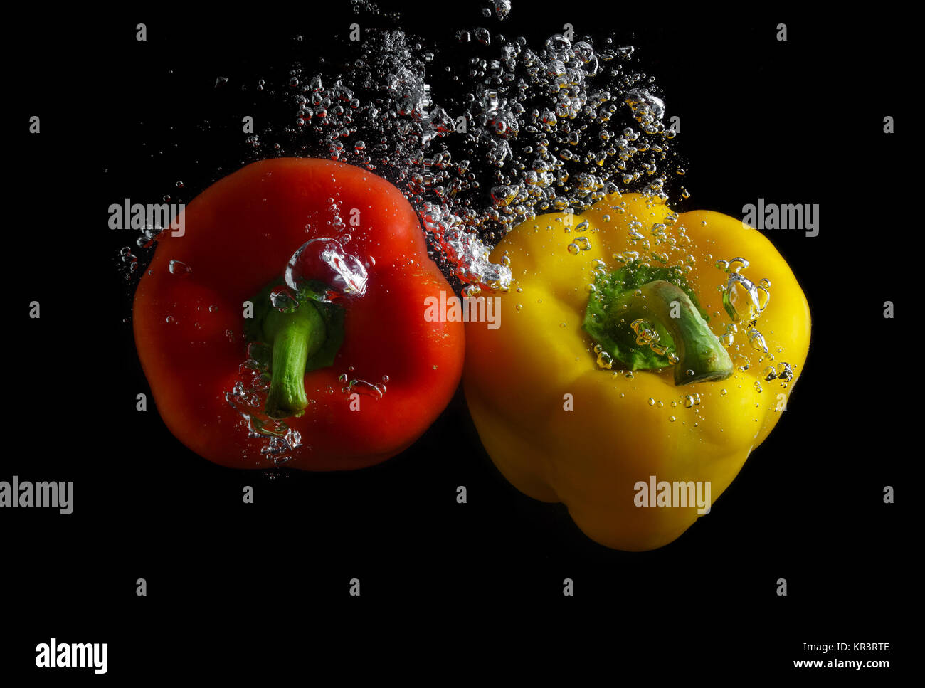 Peppers in water Stock Photo - Alamy