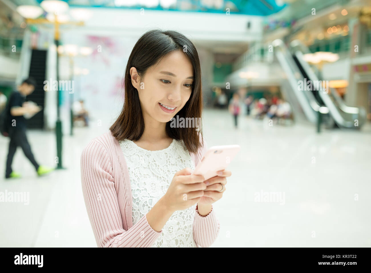 Woman watching on mobile phone Stock Photo - Alamy