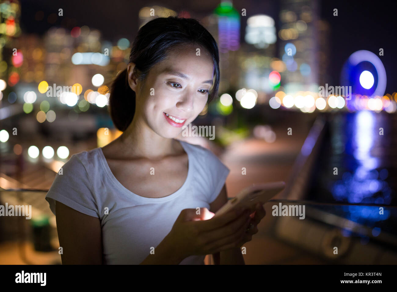 Woman use of cellphone at night Stock Photo - Alamy