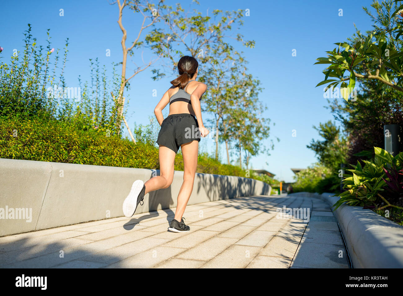 Woman running at outdoor Stock Photo - Alamy