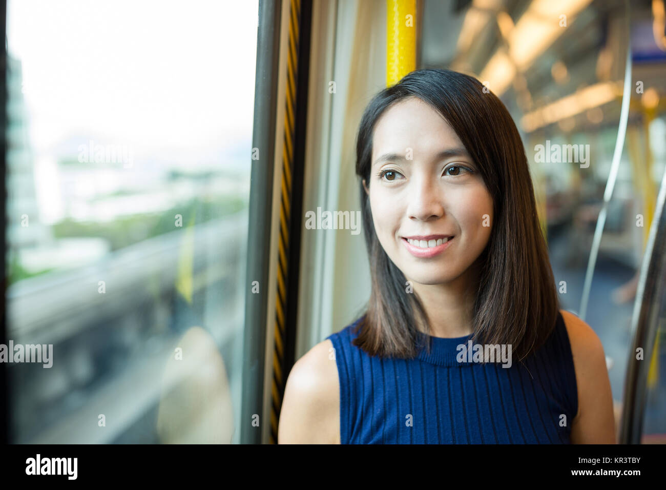 Woman taking the train Stock Photo - Alamy