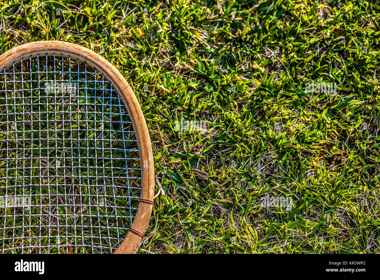 Vintage wood tennis racket on grass garden Stock Photo - Alamy