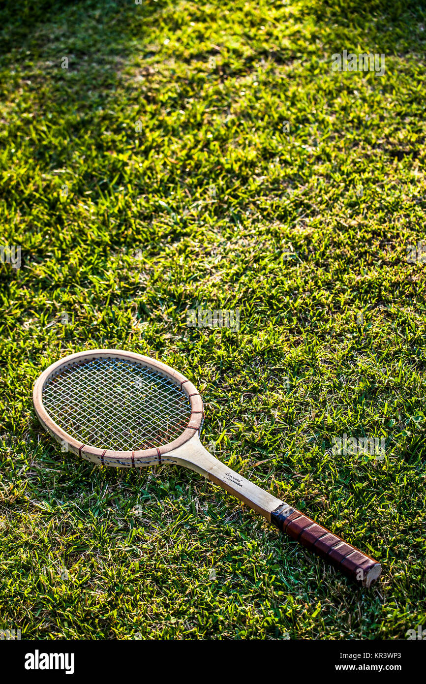 Vintage wood tennis racket on grass garden Stock Photo - Alamy