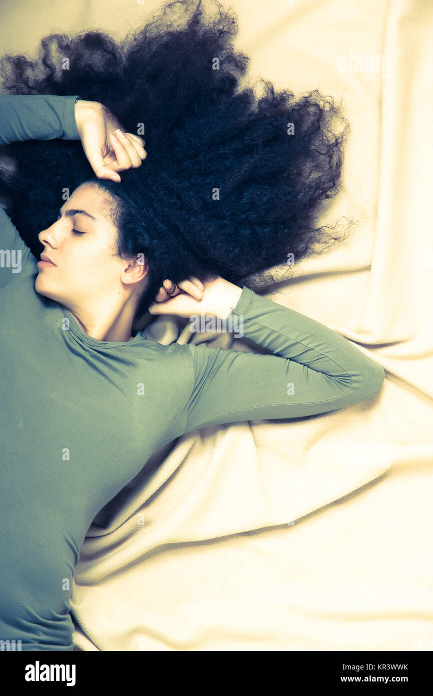 A brazilian woman having a bad night with nightmares Stock Photo - Alamy